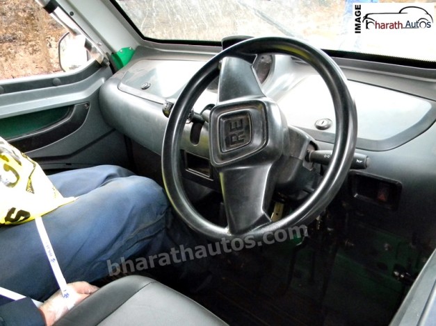 Bajaj RE60 spotted testing with dummy passengers
